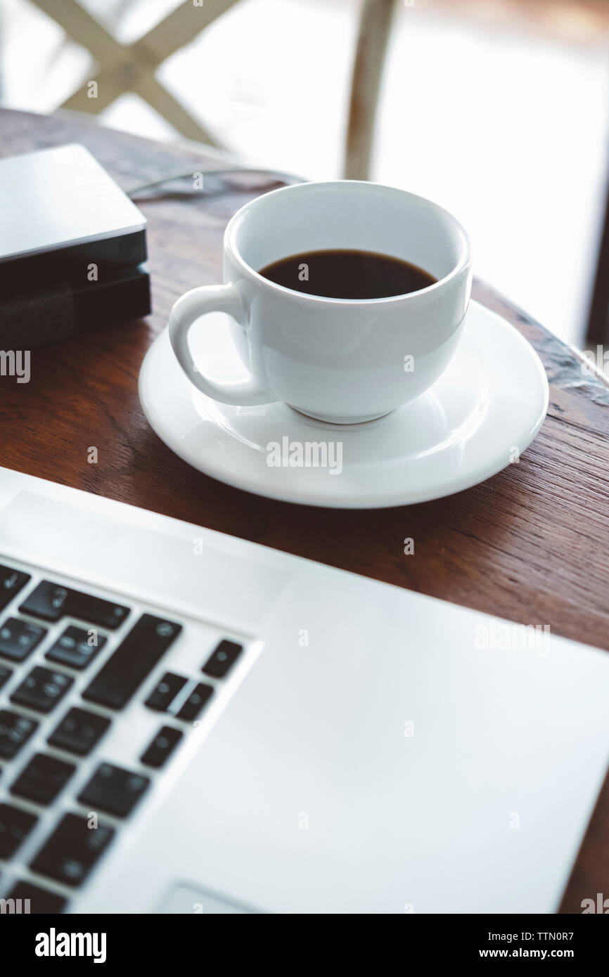 Laptop and coffee cup on wood table hi-res stock photography and images ...
