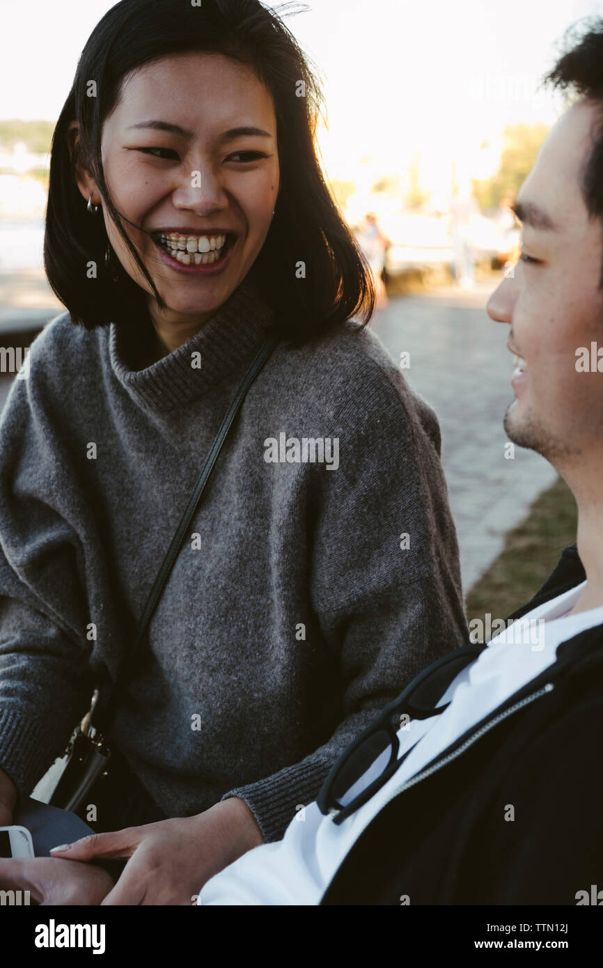 Happy couple talking sitting hi-res stock photography and images - Alamy