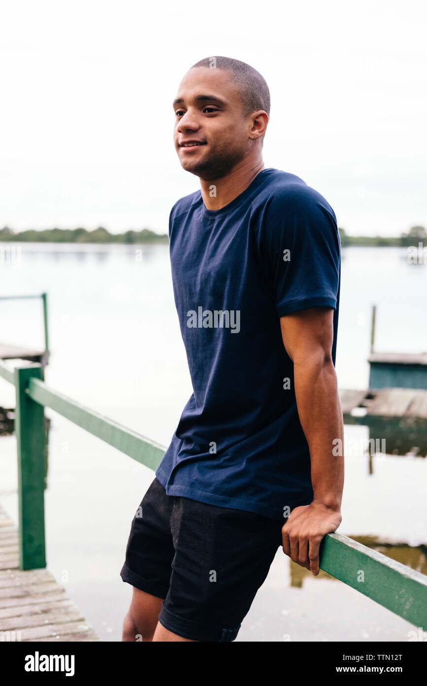 Man leaning against railing hi-res stock photography and images - Alamy