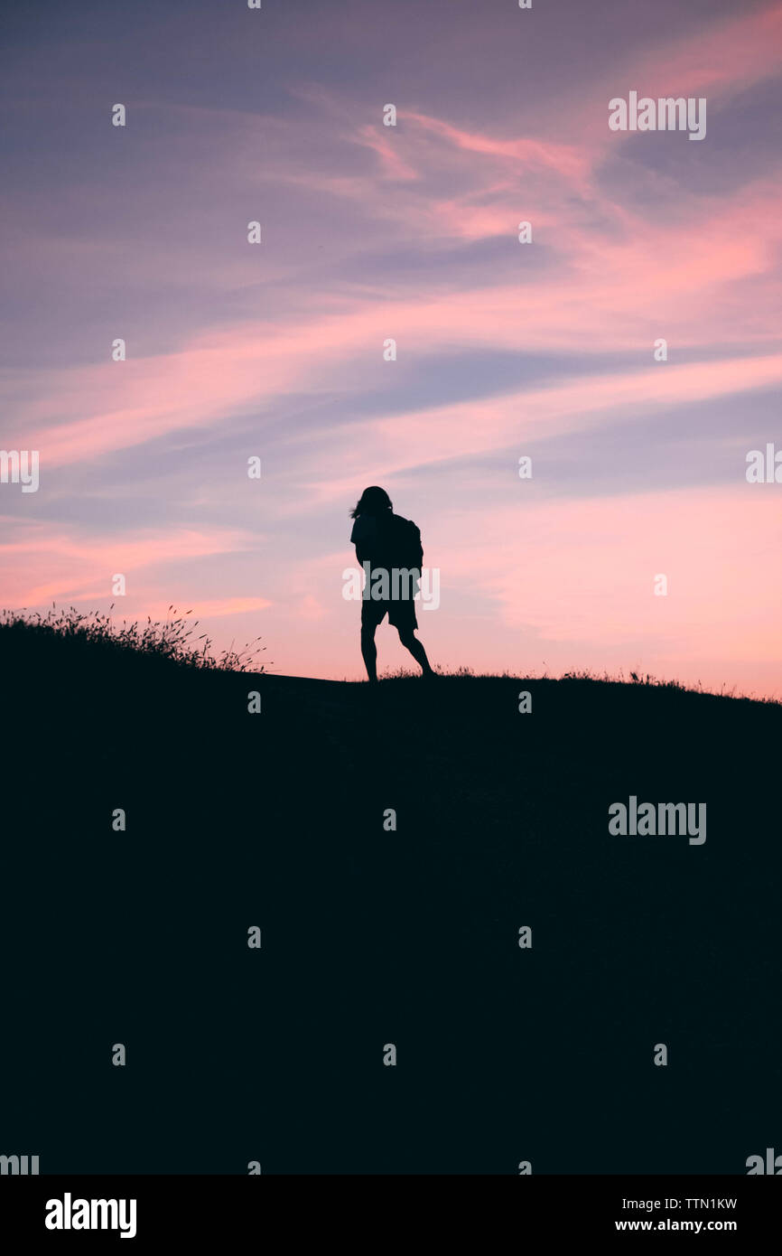 Person top hill watching hi-res stock photography and images - Alamy