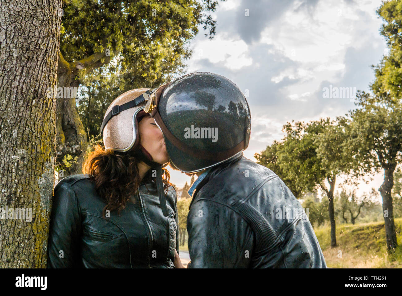 Couple Kissing Against Tree High Resolution Stock Photography and ...