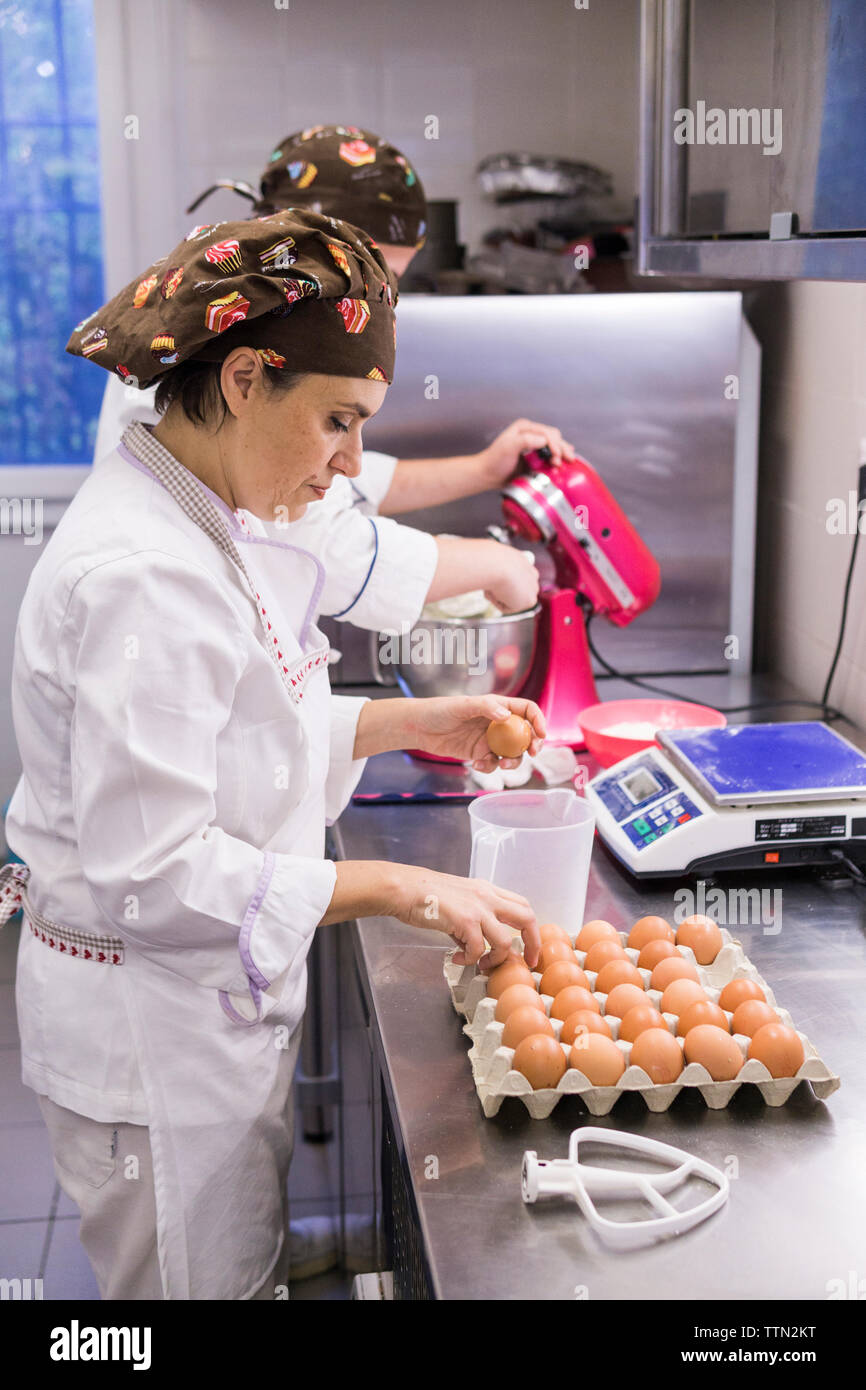 Chefs making cake on counter in kitchen at laboratory Stock Photo - Alamy