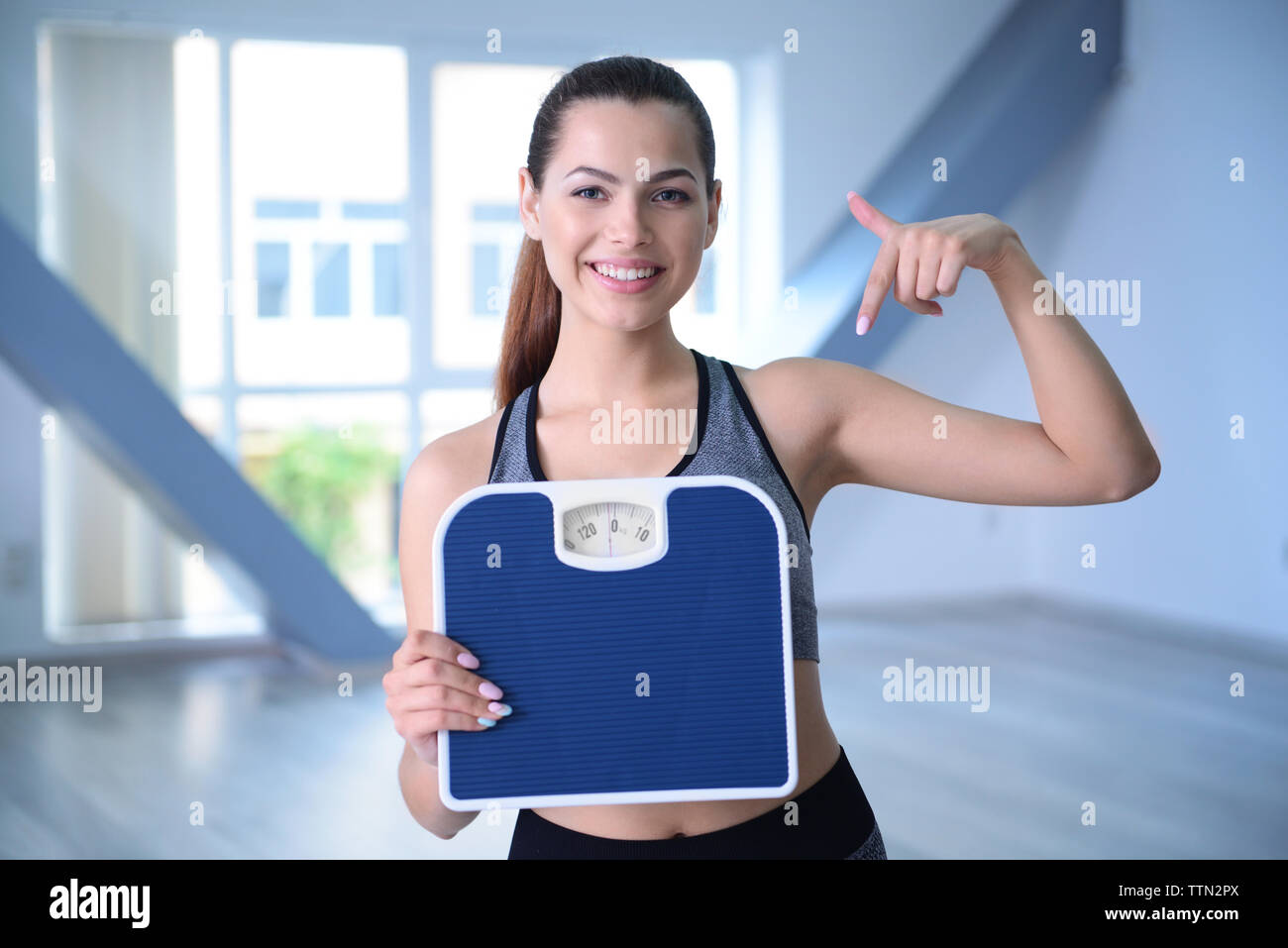 Beautiful girl with scales on blur background Stock Photo - Alamy