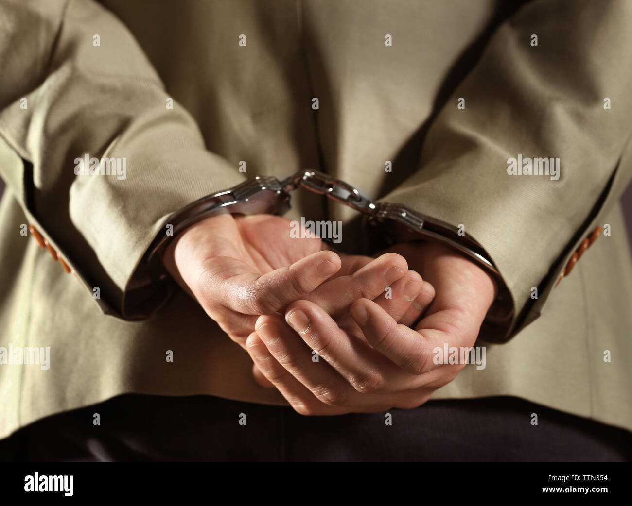 Man in suit handcuffs hi-res stock photography and images - Alamy