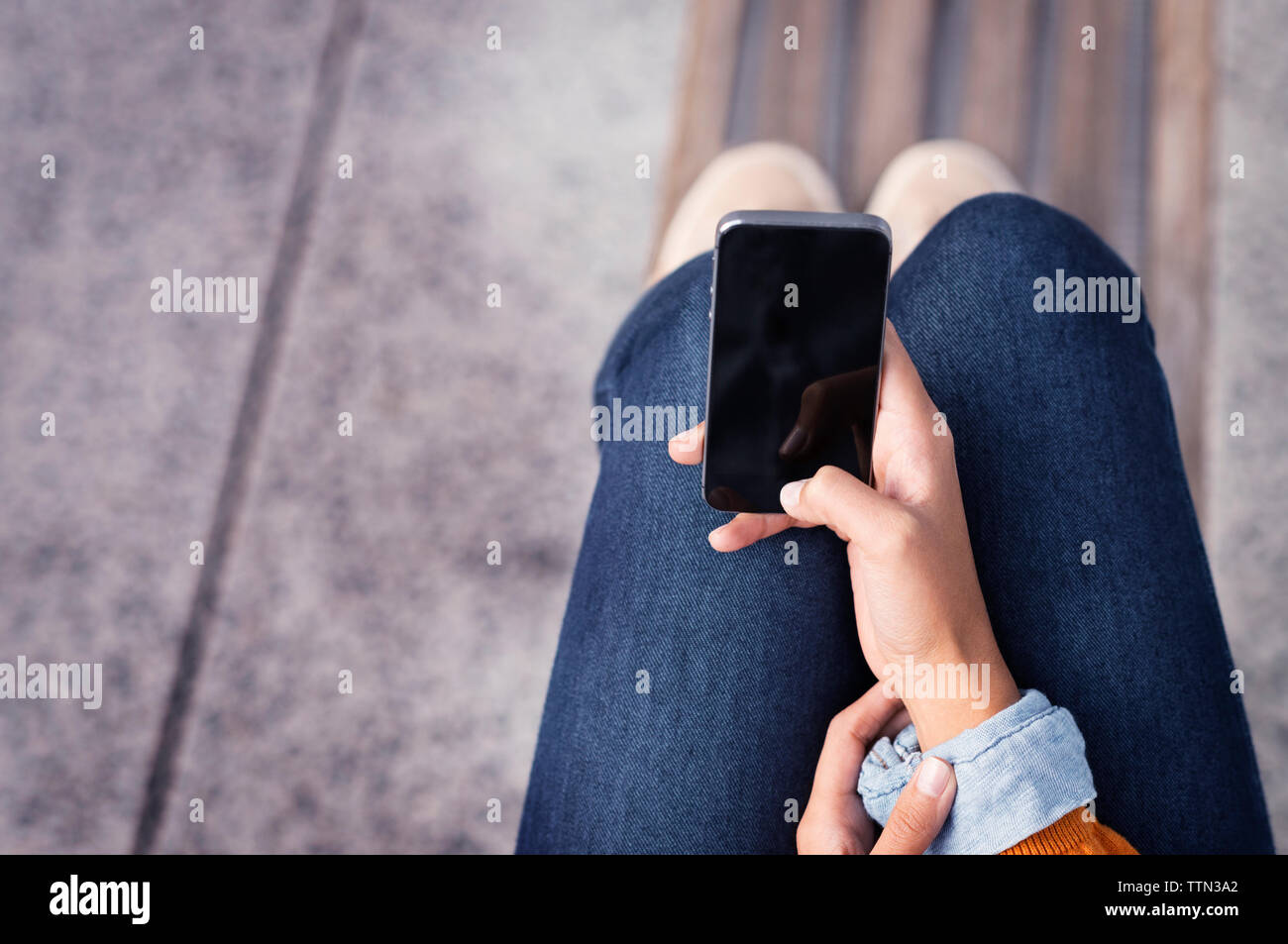 Personal perspective of woman turning on smart phone Stock Photo - Alamy