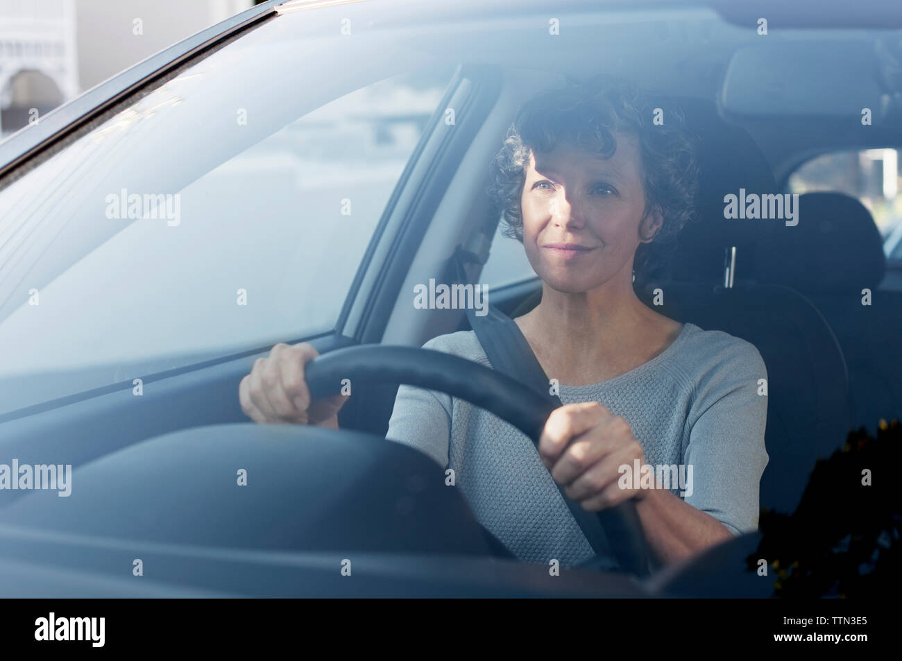 Mature woman driving car hi-res stock photography and images - Alamy