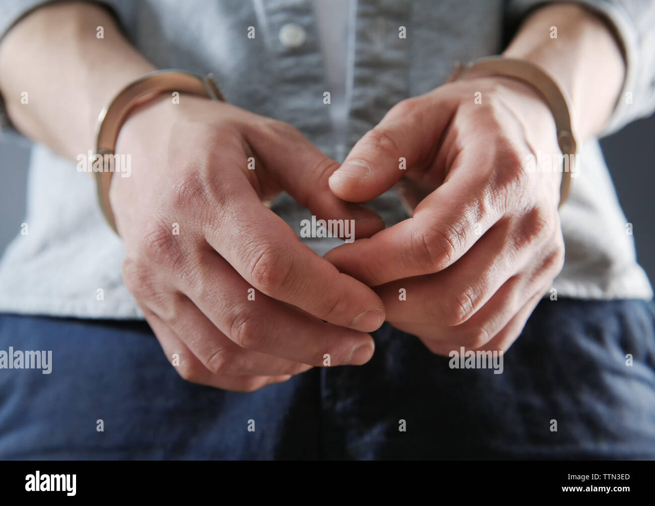 Man in handcuffs, closeup Stock Photo - Alamy
