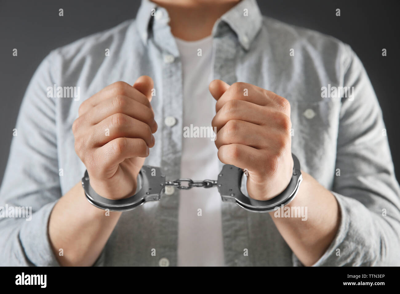 Man in handcuffs, closeup Stock Photo - Alamy