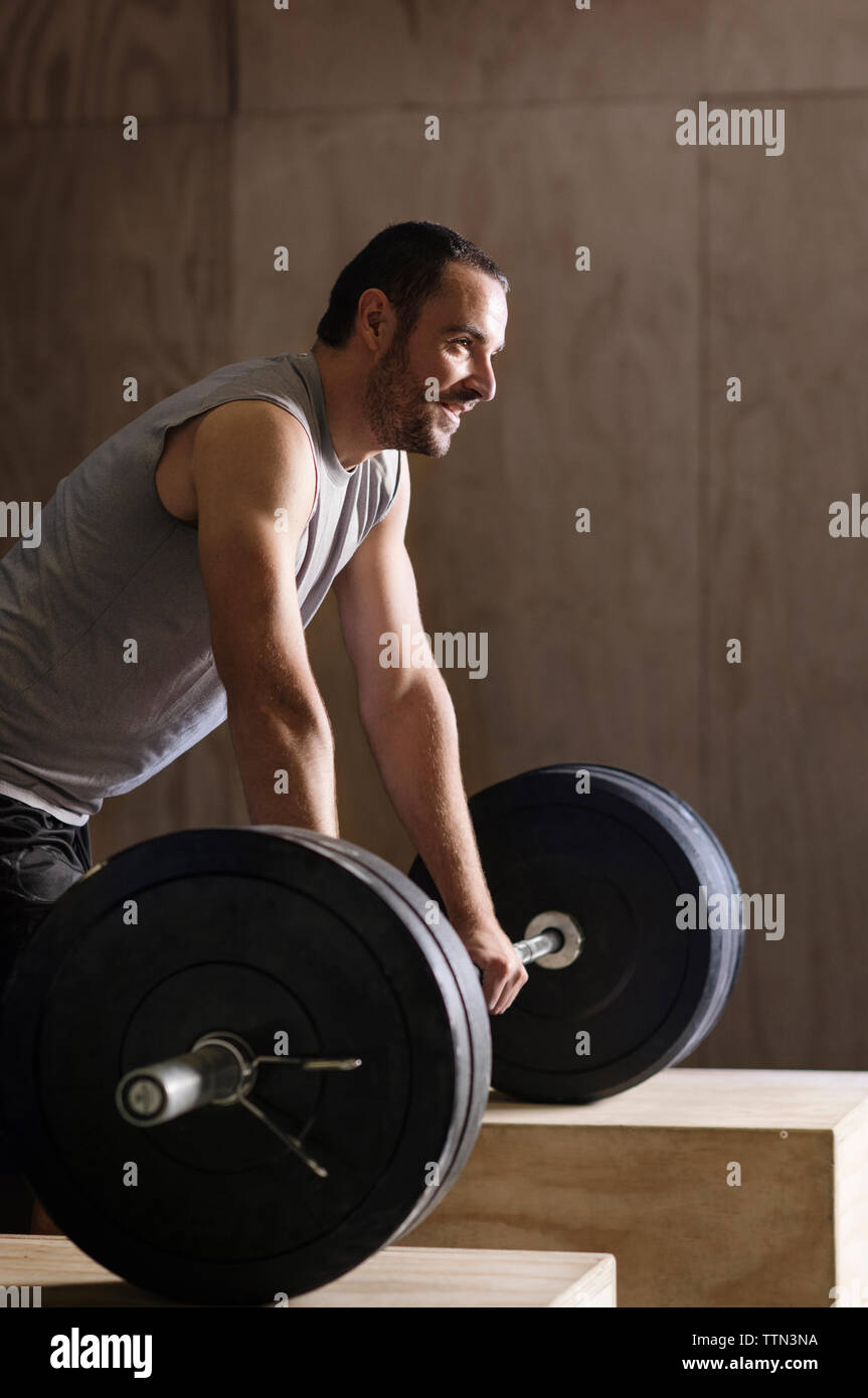 Side view of man lifting arm hi-res stock photography and images - Alamy