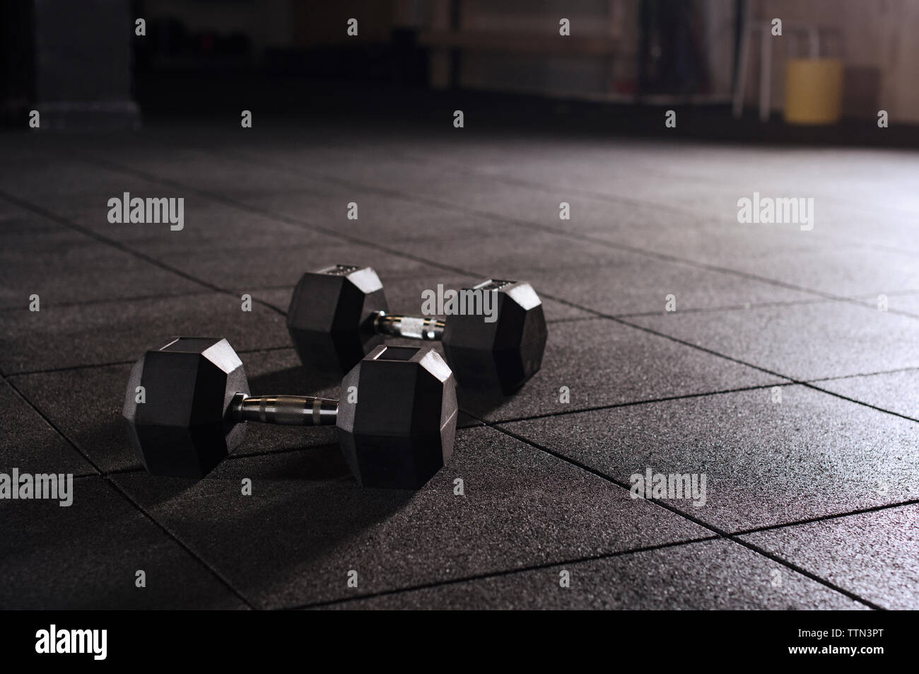 Fitness class exercising with dumbbells in a bright gym Stock Photo - Alamy