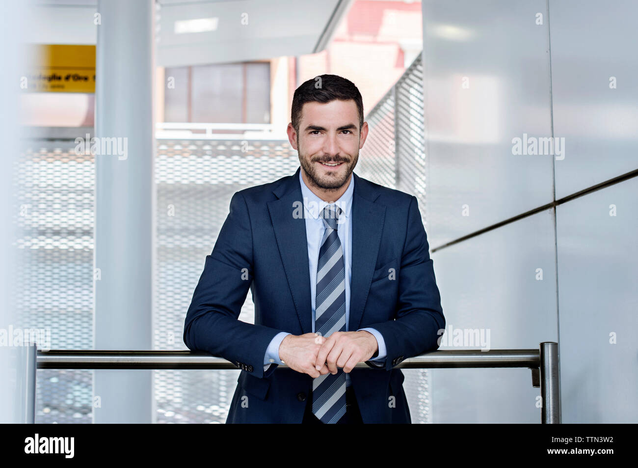 Leaning standing suit well dressed hi-res stock photography and images ...