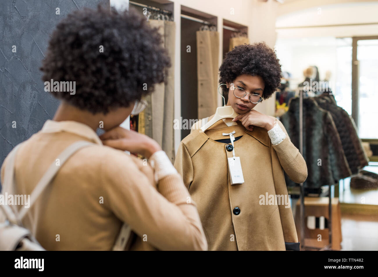 Reflection in mirror woman shopping hi-res stock photography and images ...