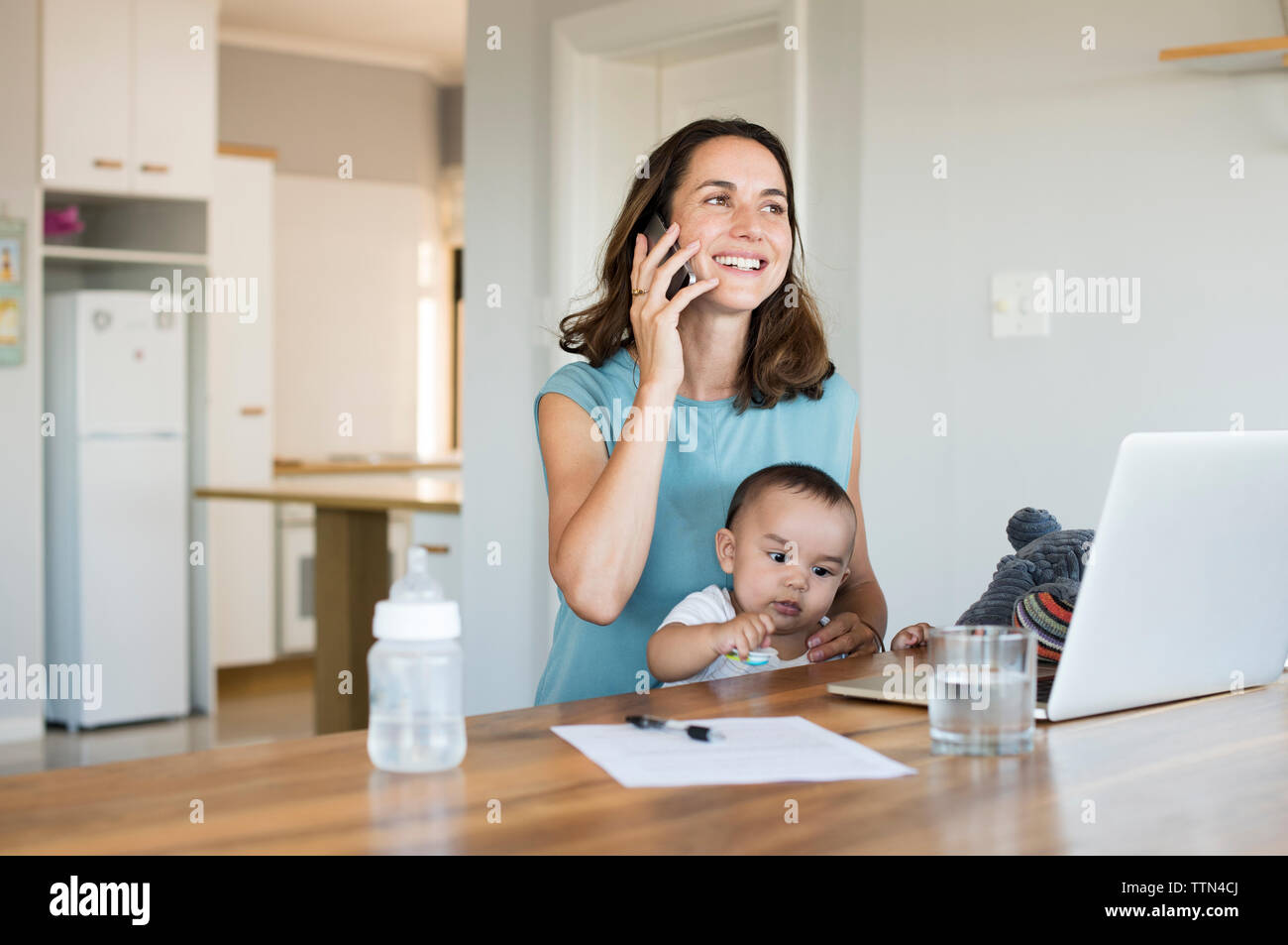 Son and mother looking home talking hi-res stock photography and images ...