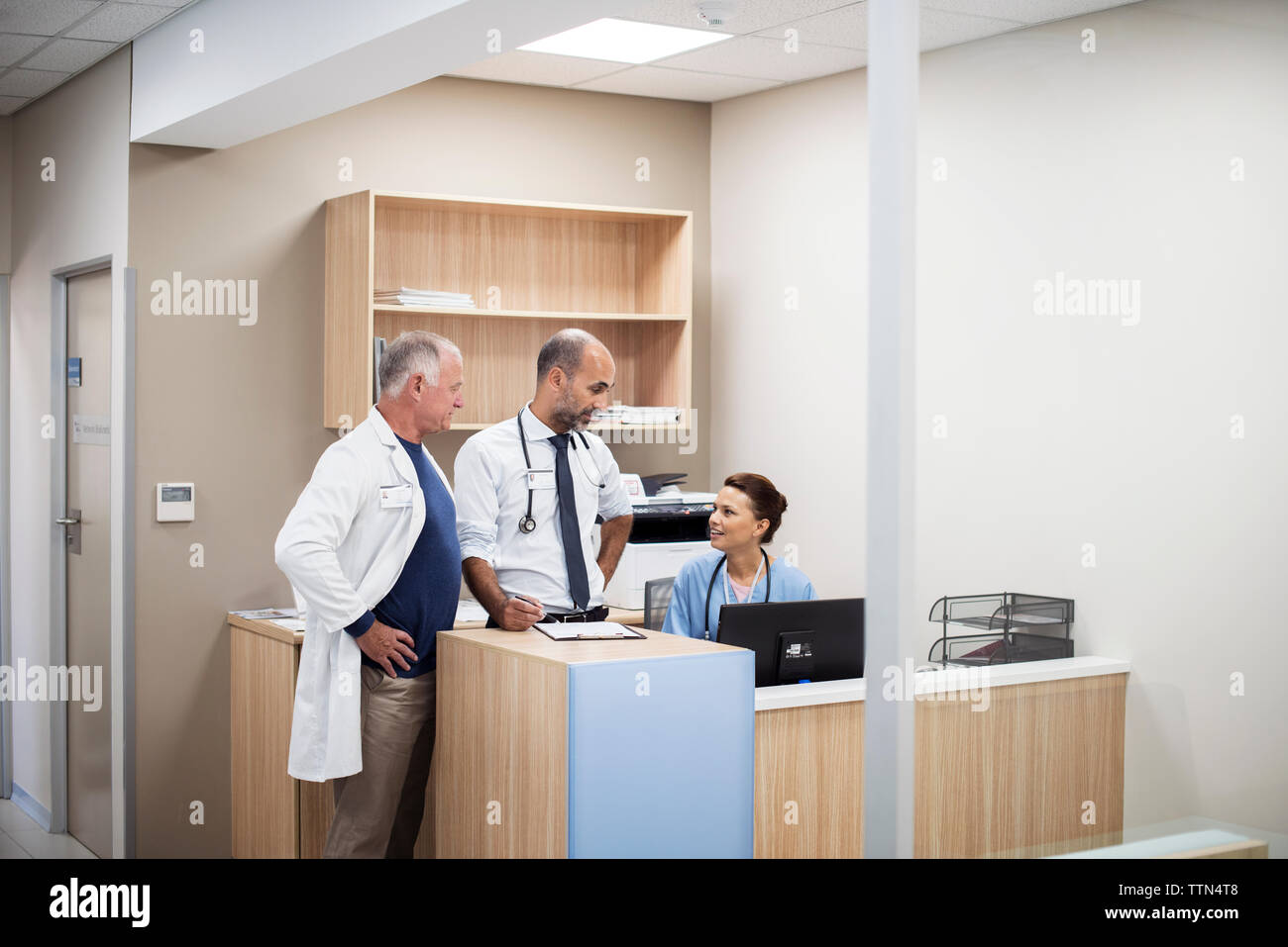 Doctors discussing in room at hospital Stock Photo - Alamy