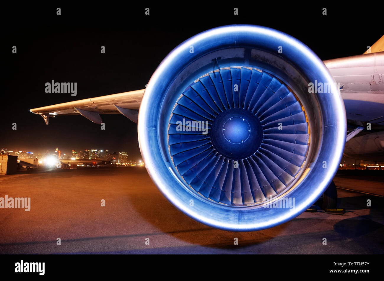 Aircraft jet engine on runway at night Stock Photo - Alamy