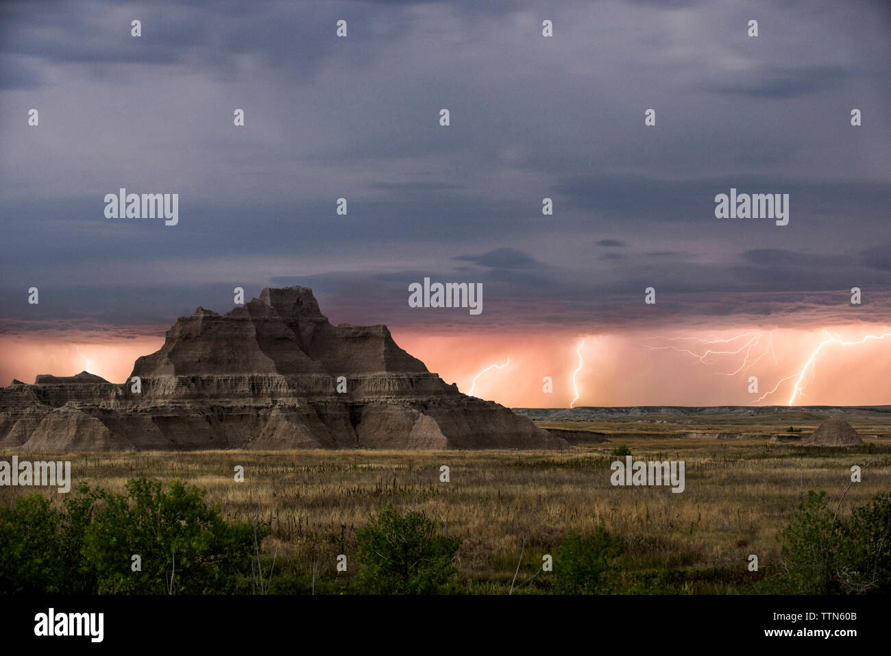 Thunderstorm over Badlands National Park at night Stock Photo - Alamy