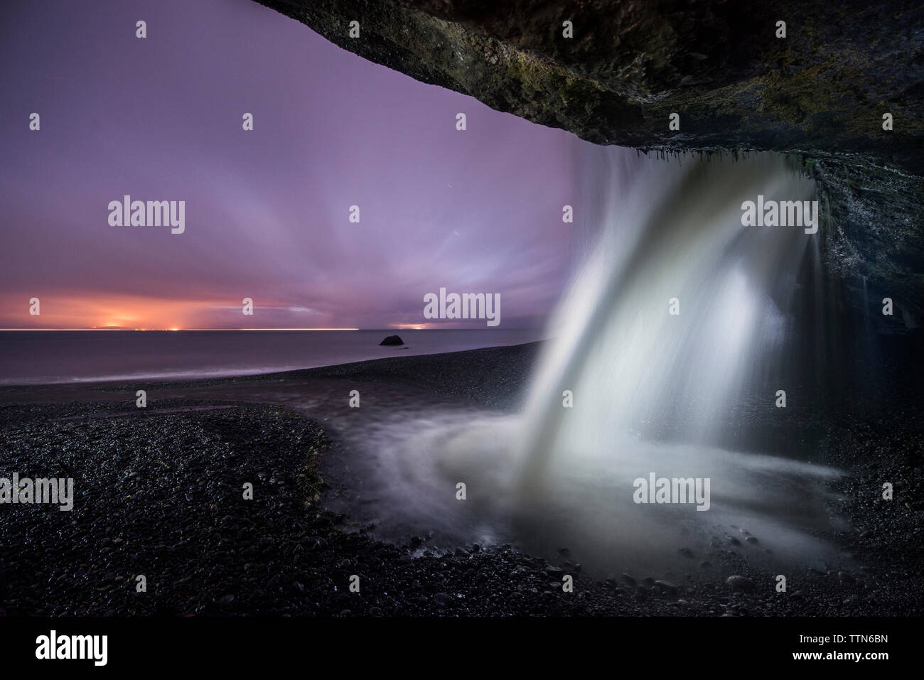Mystic beach waterfall hi-res stock photography and images - Alamy