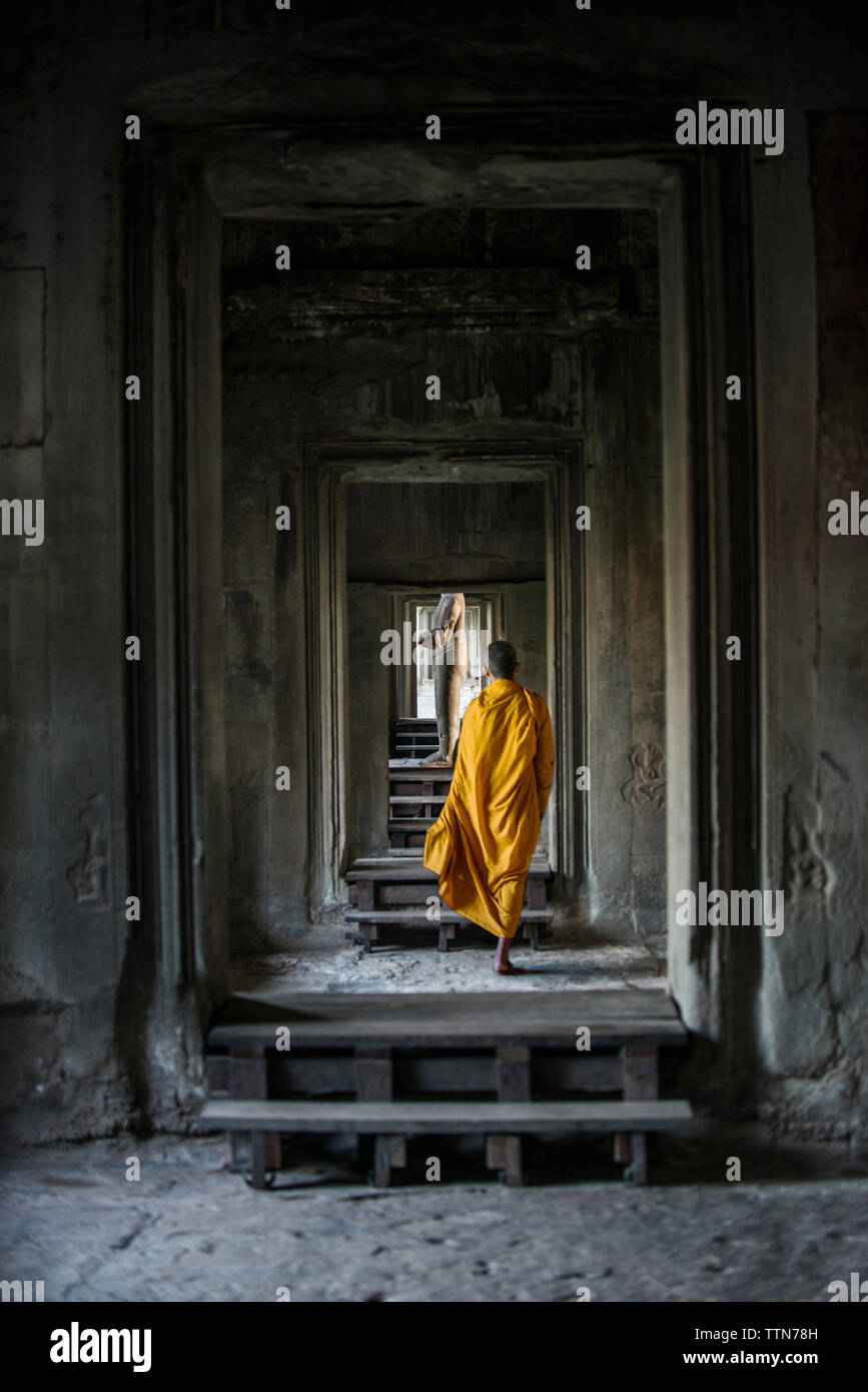 Rear view of monk walking in Angkor Wat Stock Photo - Alamy