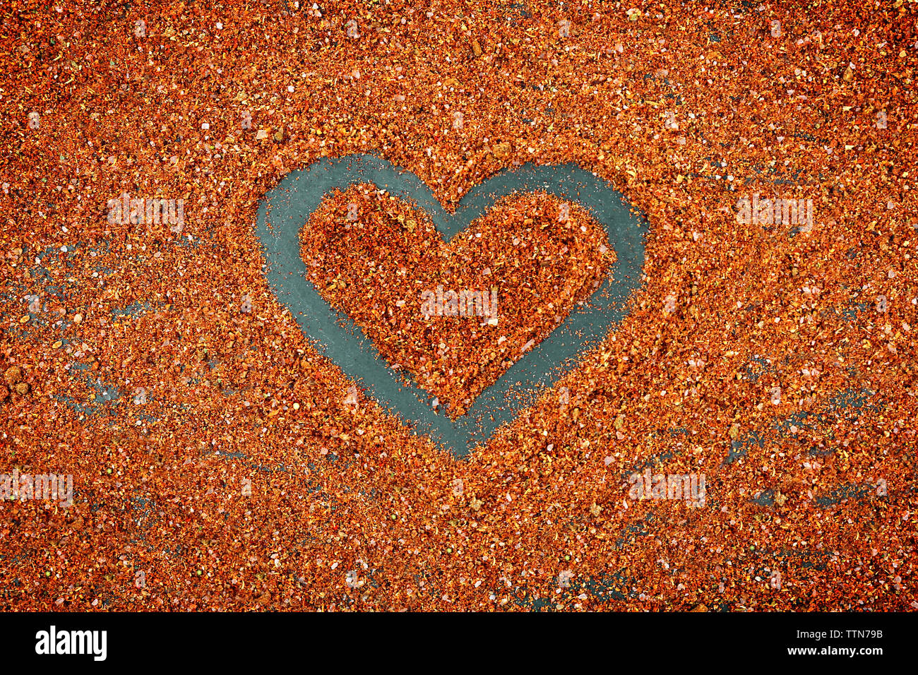 Dried spice with heart silhouette on gray background Stock Photo - Alamy