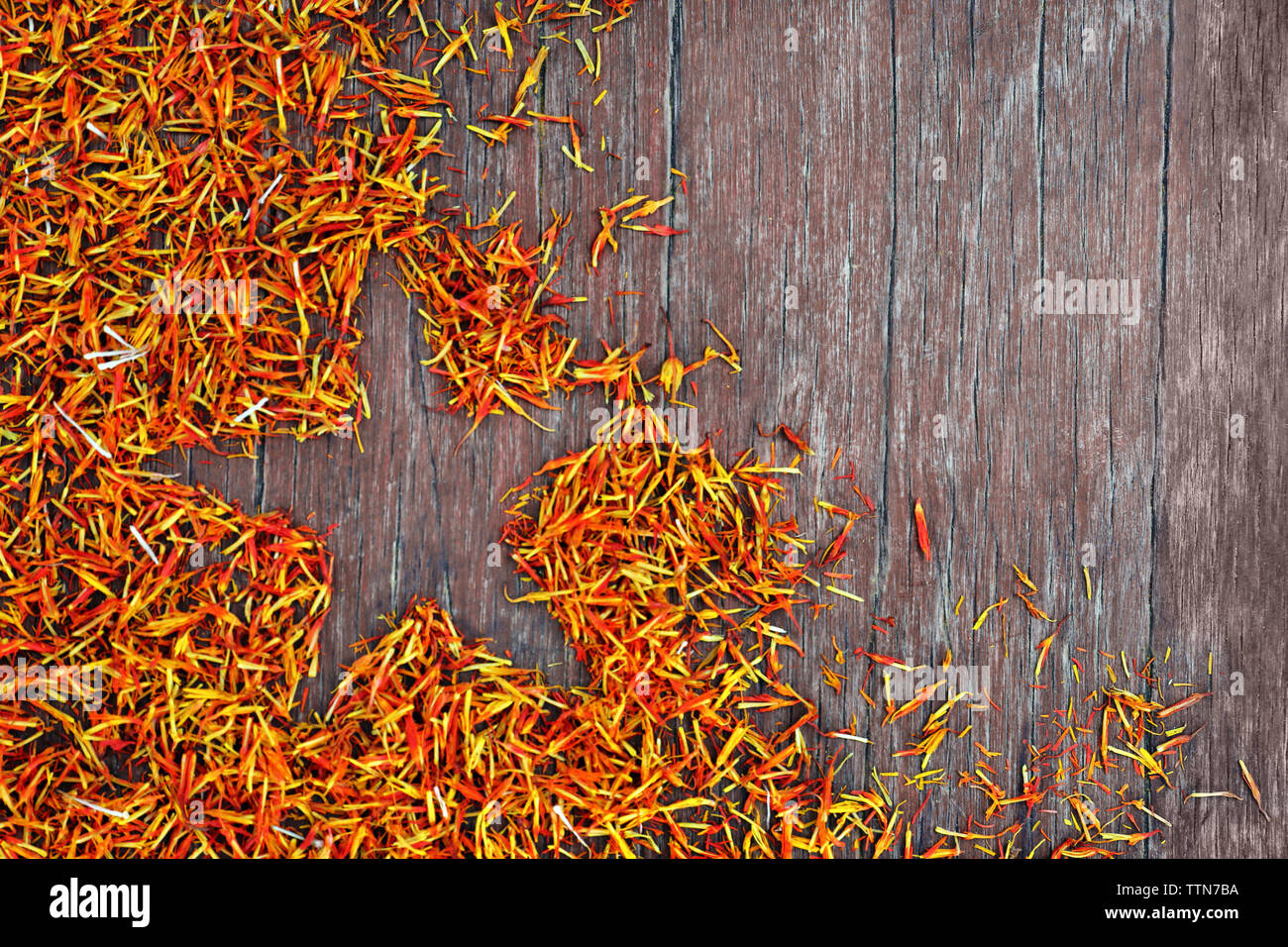Saffron with star silhouette on wooden background Stock Photo - Alamy