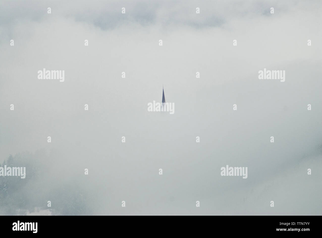 Spire amidst fog Stock Photo - Alamy