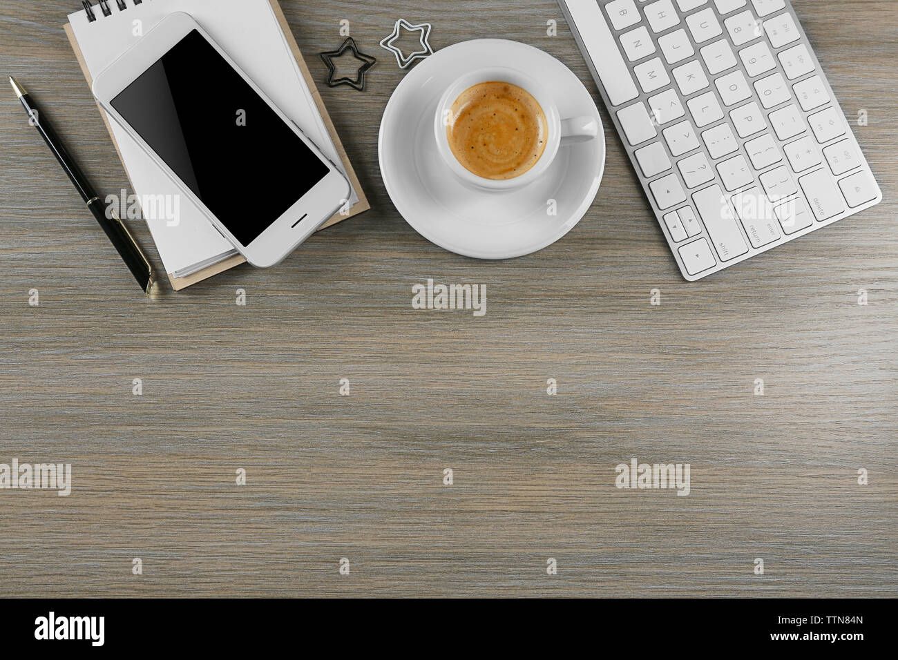 Modern workplace with cup of coffee Stock Photo - Alamy