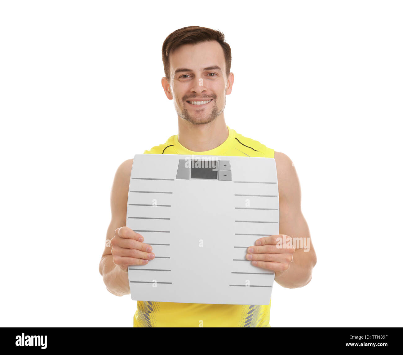 Man holding weight scale isolated on white Stock Photo - Alamy