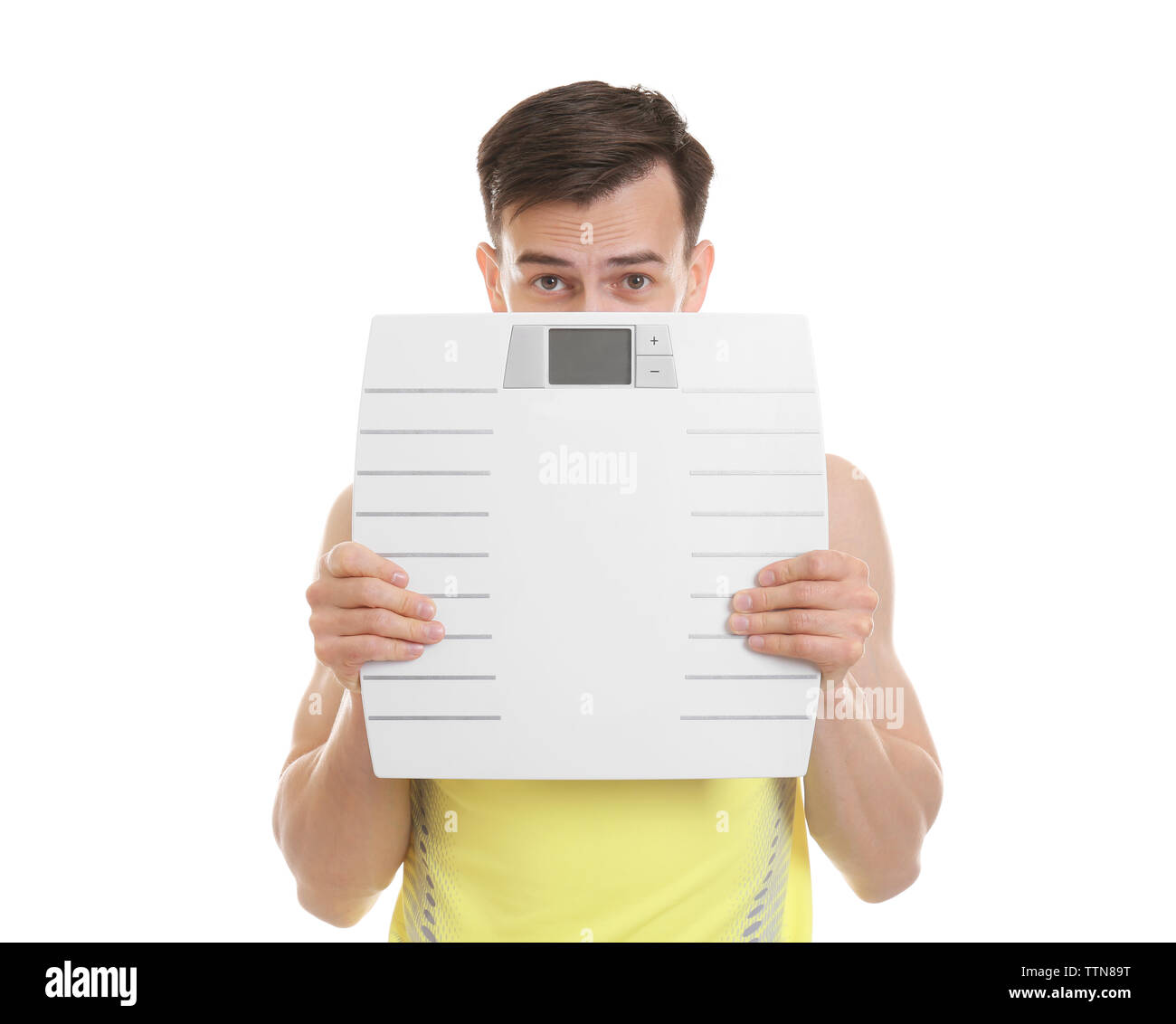 Man holding weight scale isolated on white Stock Photo - Alamy