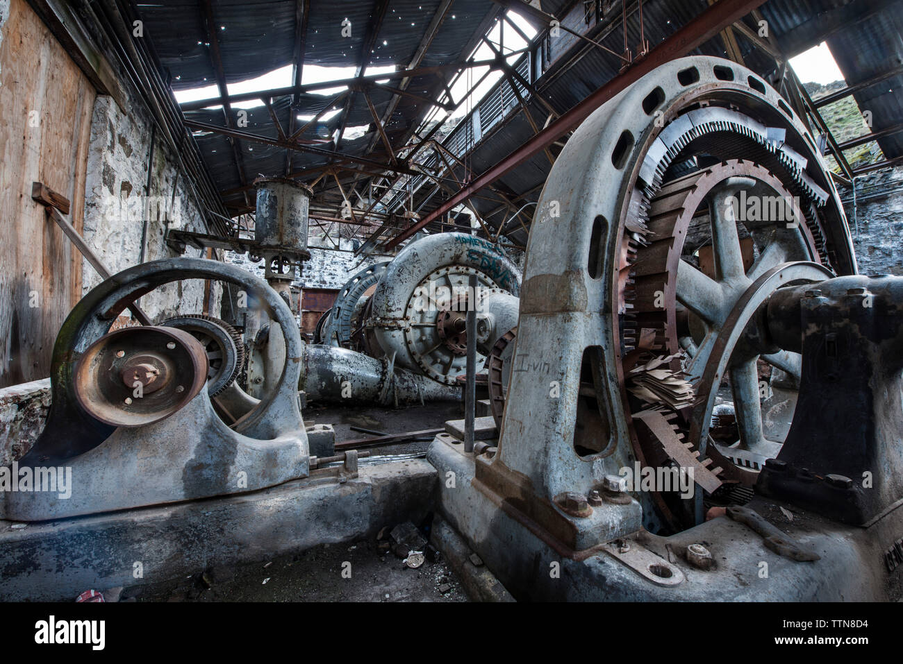 Machinery in abandoned industry Stock Photo - Alamy