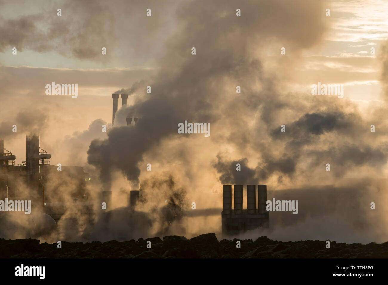 Smoke emitting from factory Stock Photo - Alamy
