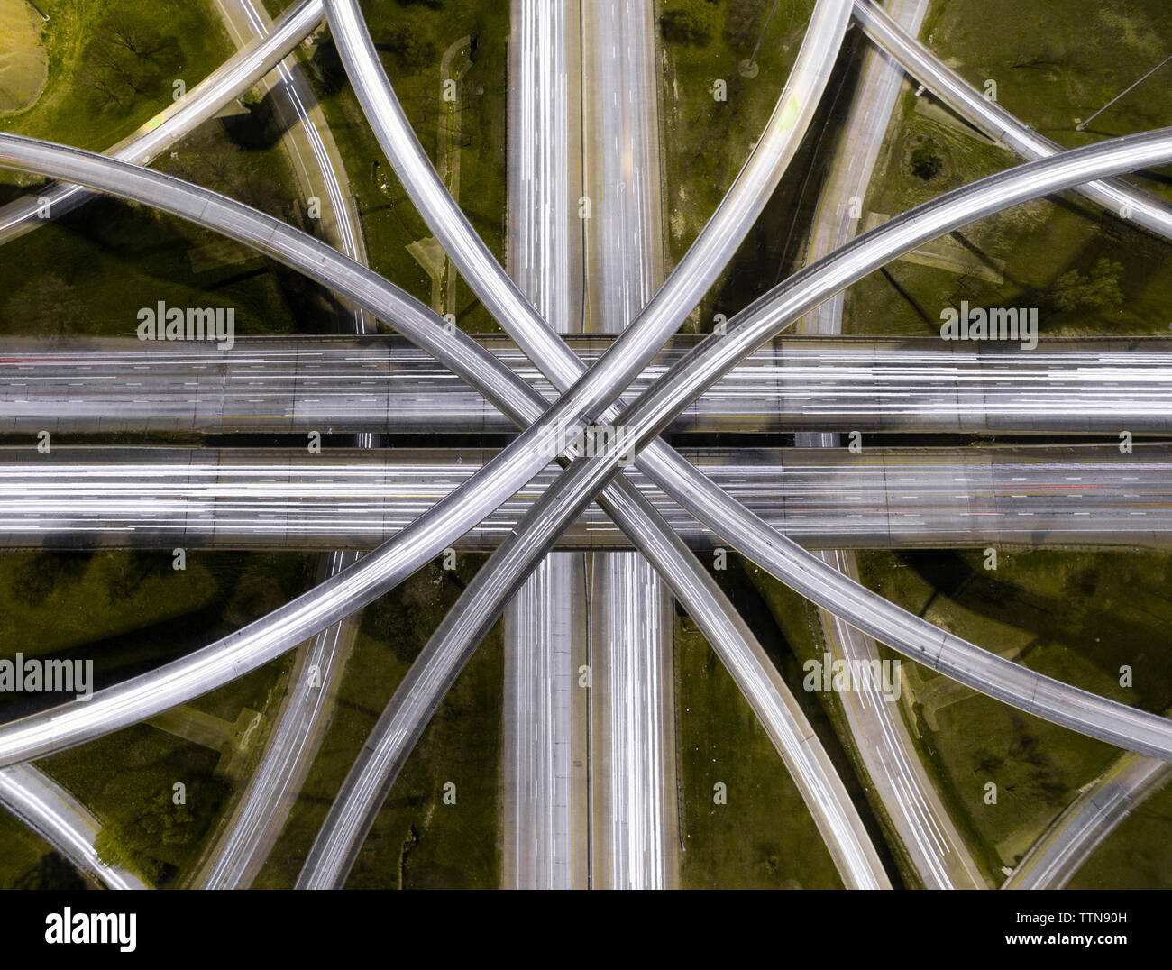 Aerial view of light trails on road intersections in city Stock Photo ...