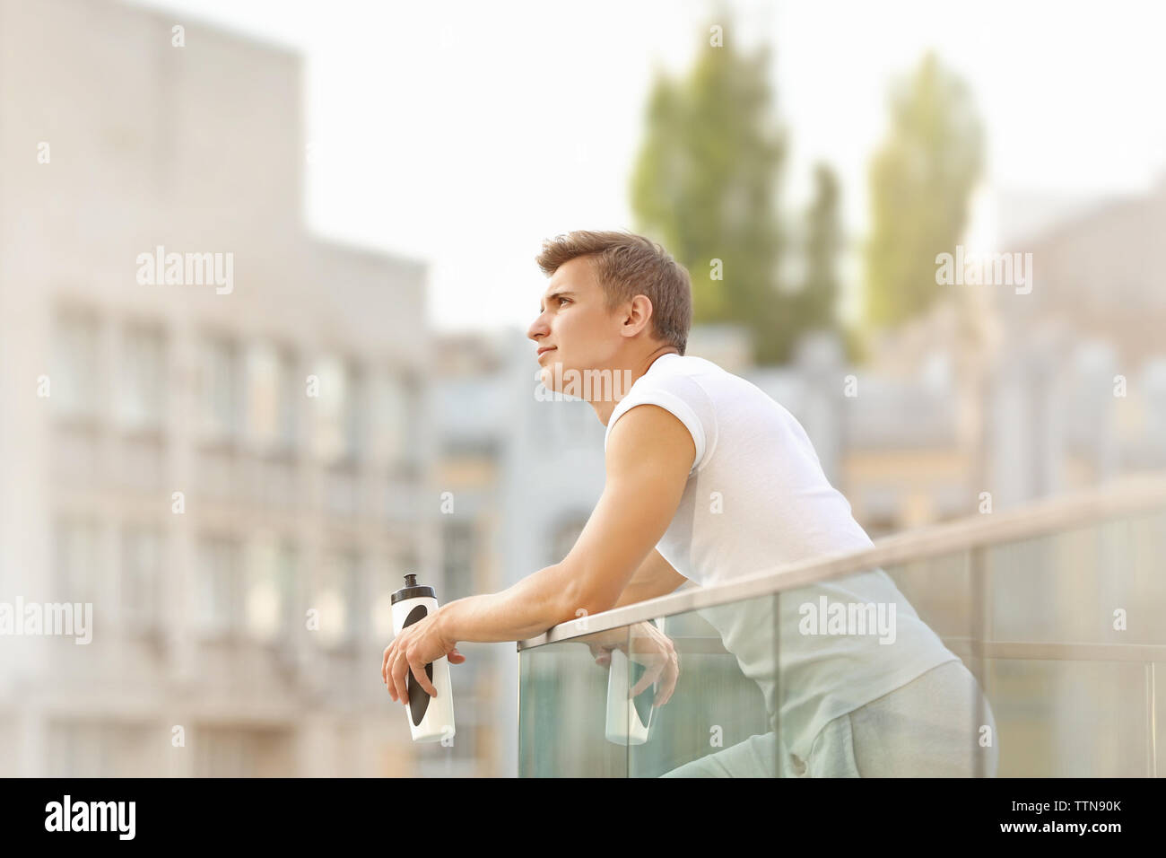 Man standing on his balcony hi-res stock photography and images - Alamy