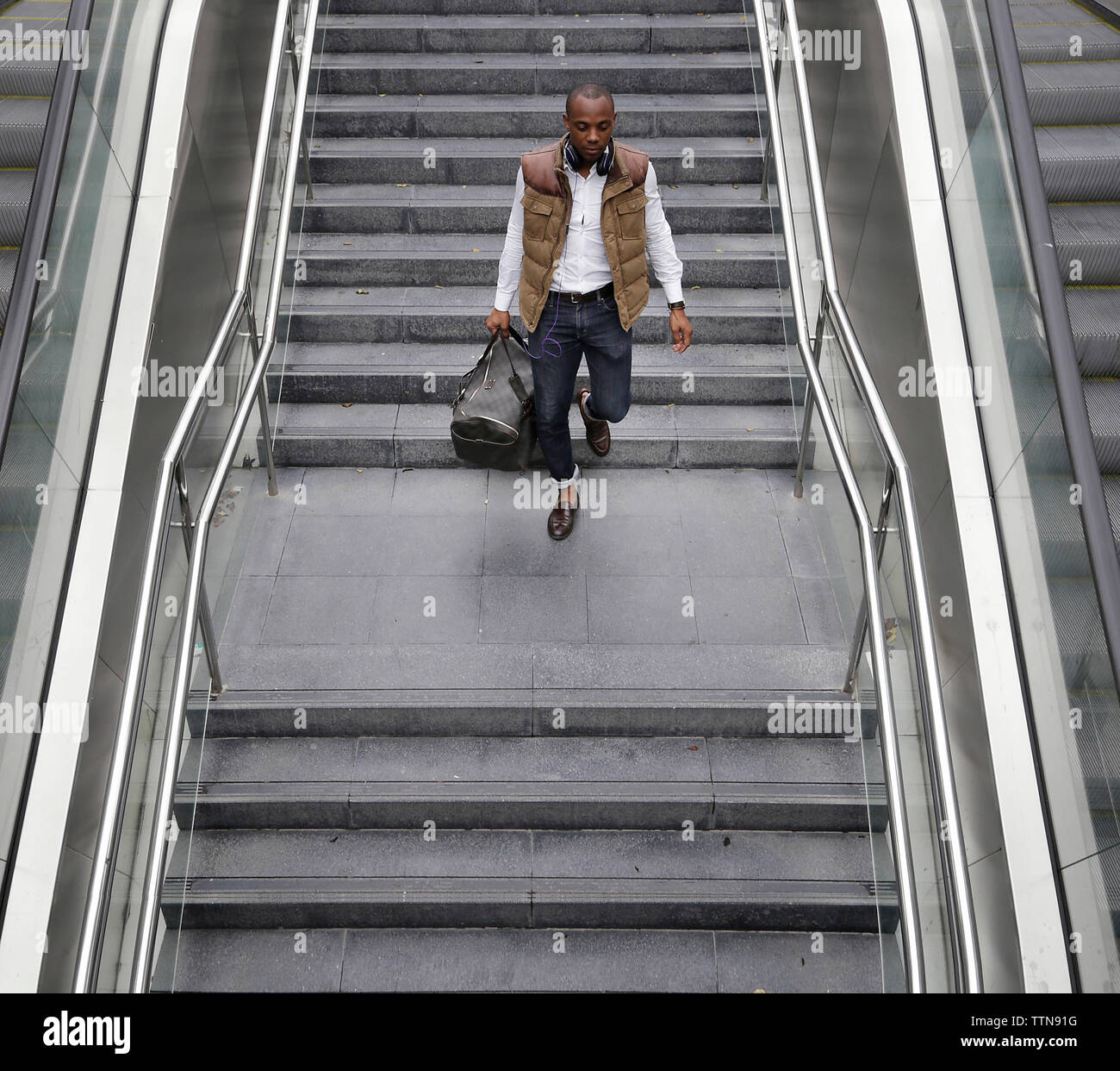 Old man walking down steps hi-res stock photography and images - Alamy
