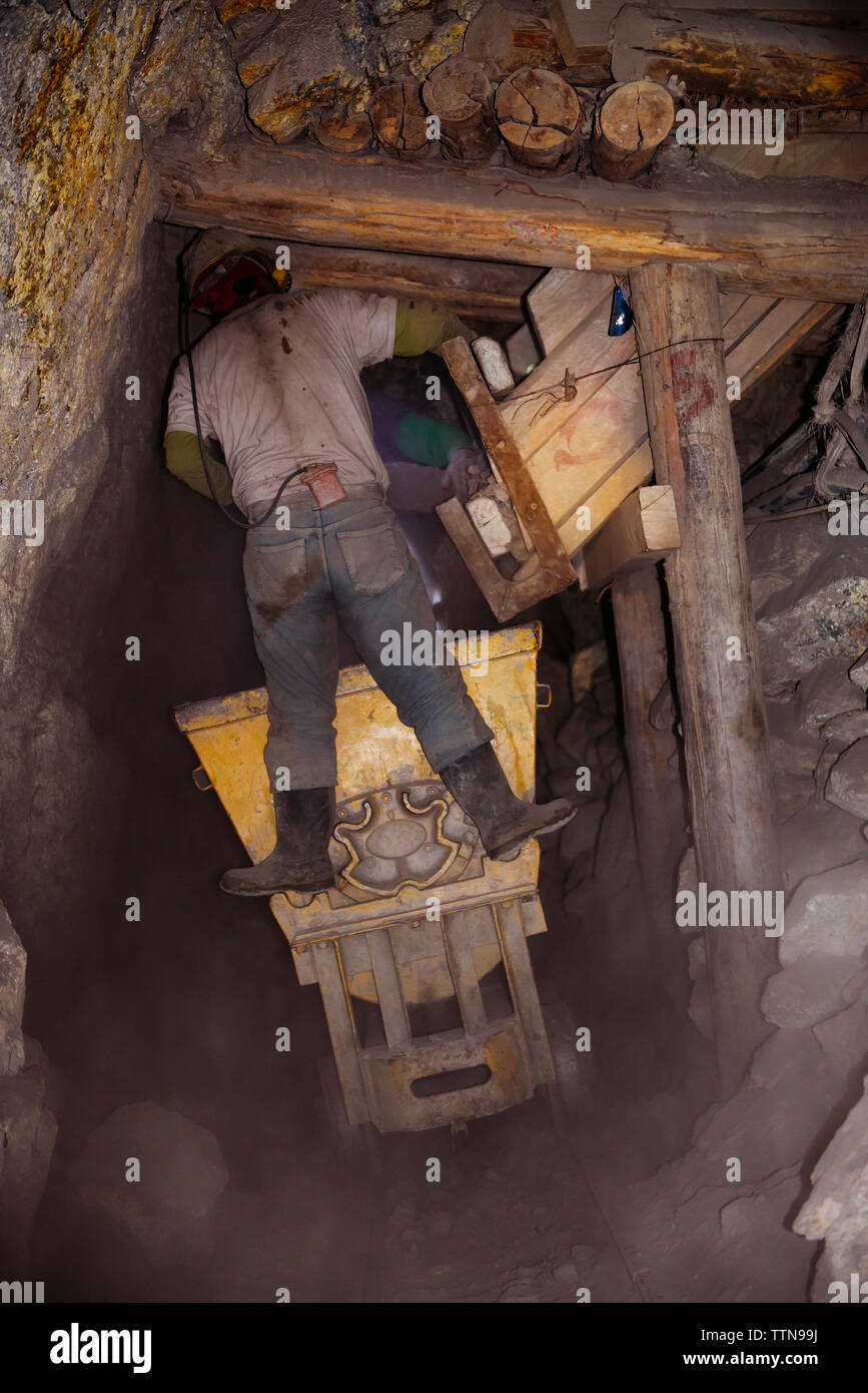 Manual workers working at construction site Stock Photo - Alamy