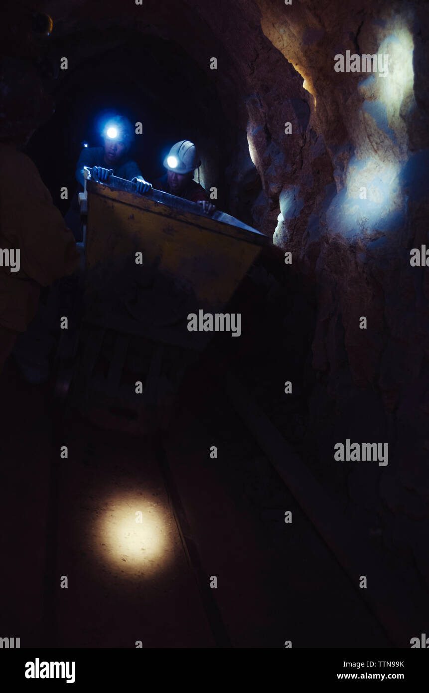 workers dumping coal mines in cave at construction site Stock Photo - Alamy