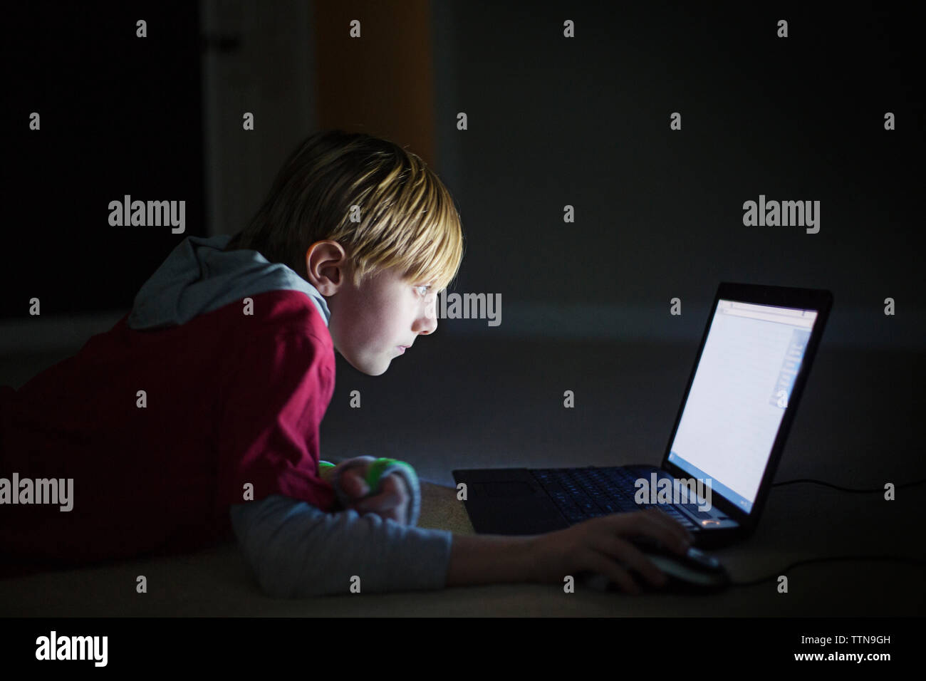 Boy using internet hi-res stock photography and images - Alamy