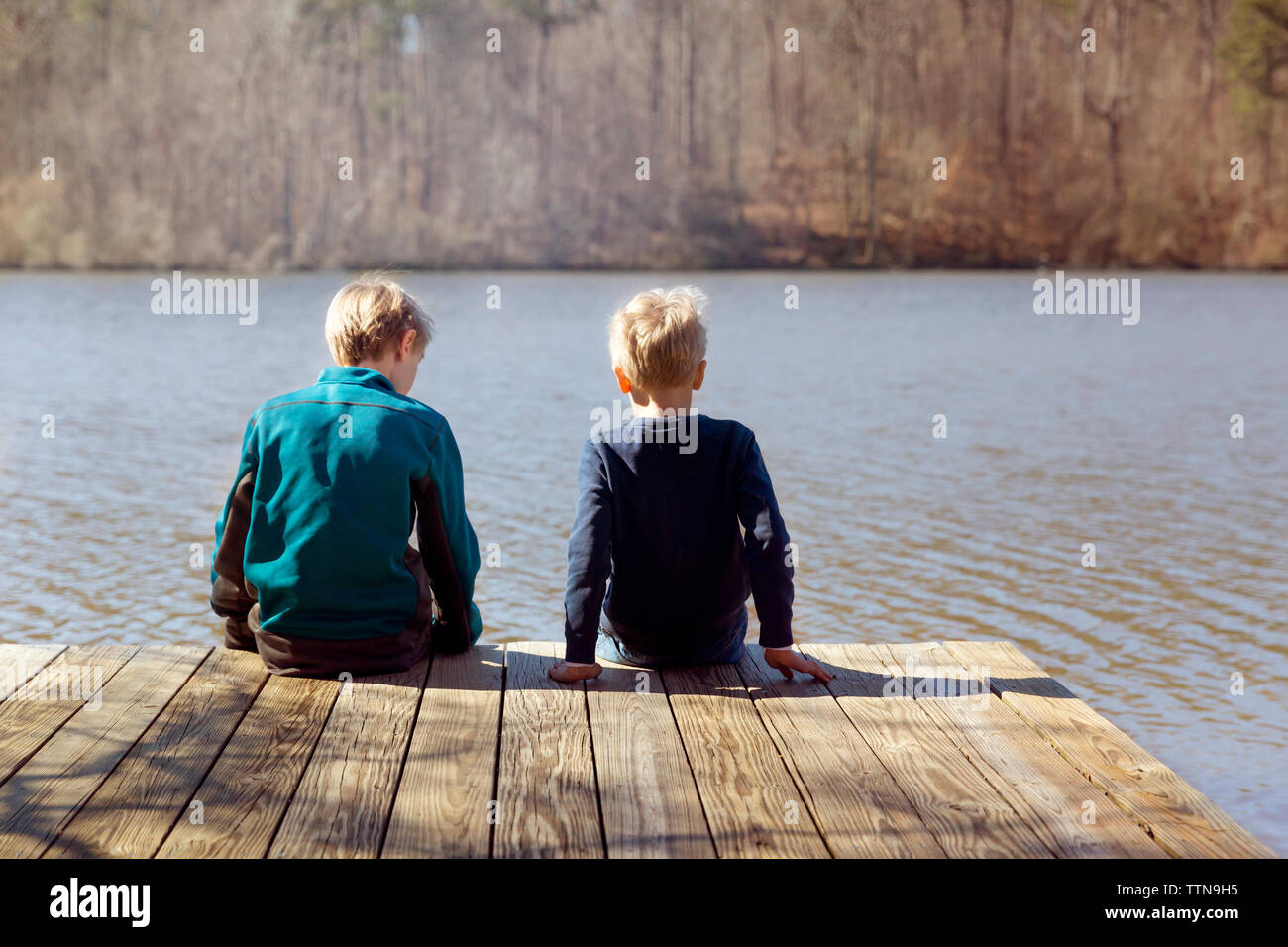 Two boys on pier hi-res stock photography and images - Alamy
