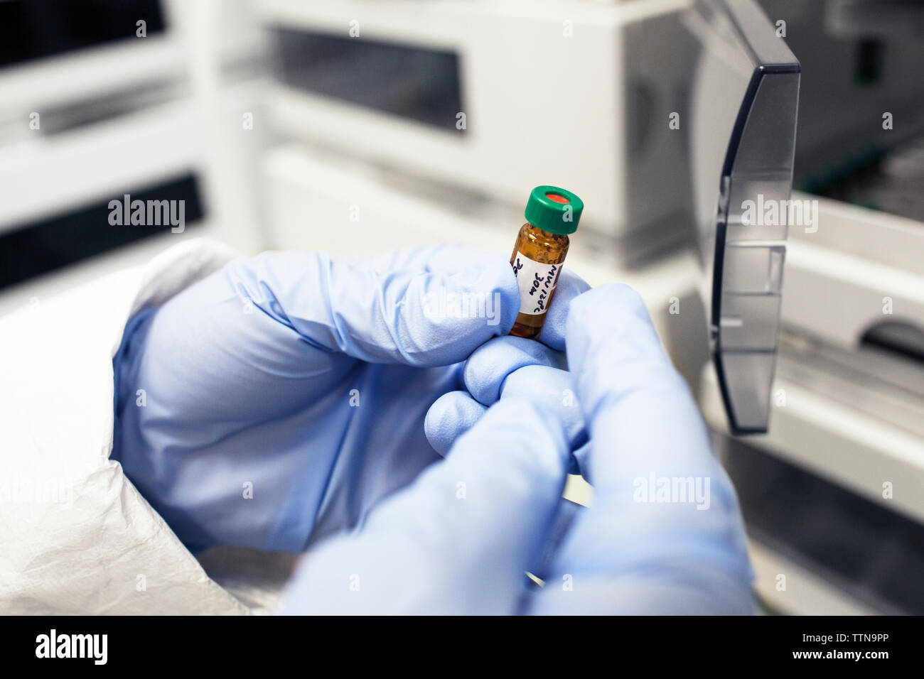 Hands holding scientific sample Stock Photo - Alamy