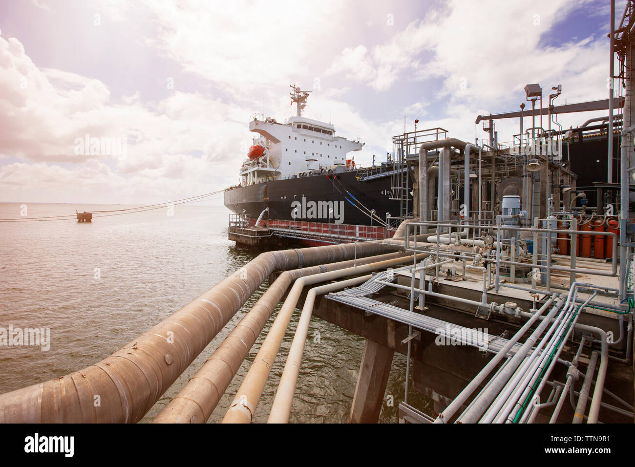 View of pipelines and oil tanker Stock Photo - Alamy