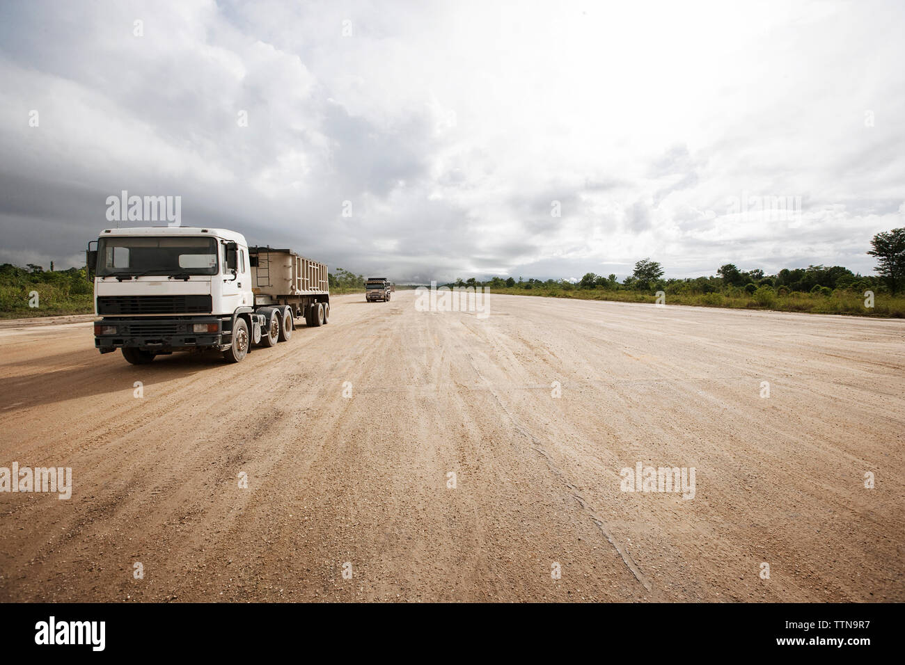 Semi-trucks on road Stock Photo - Alamy