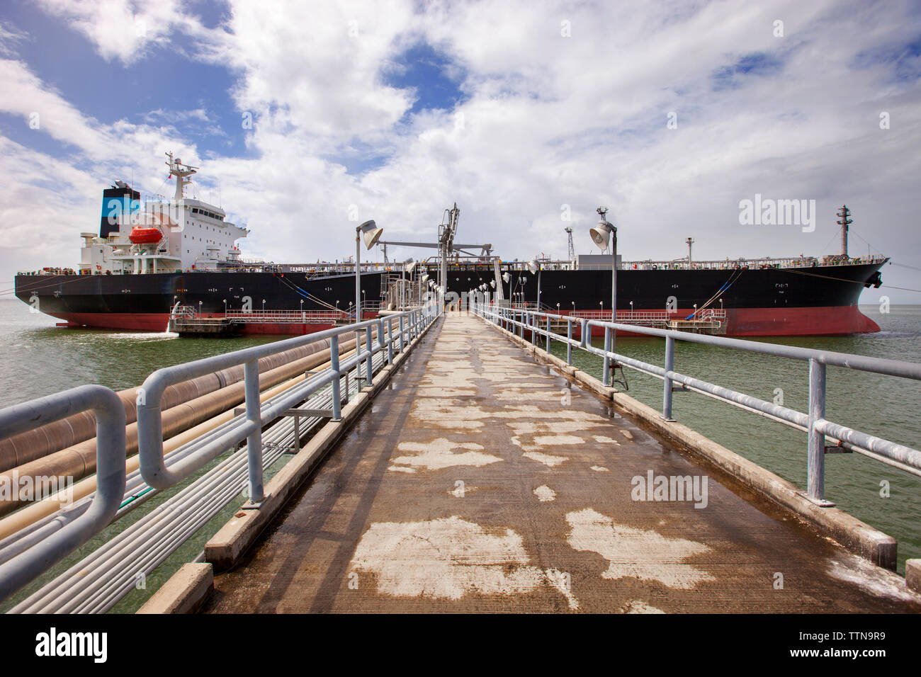 View of pipelines and oil tanker Stock Photo - Alamy