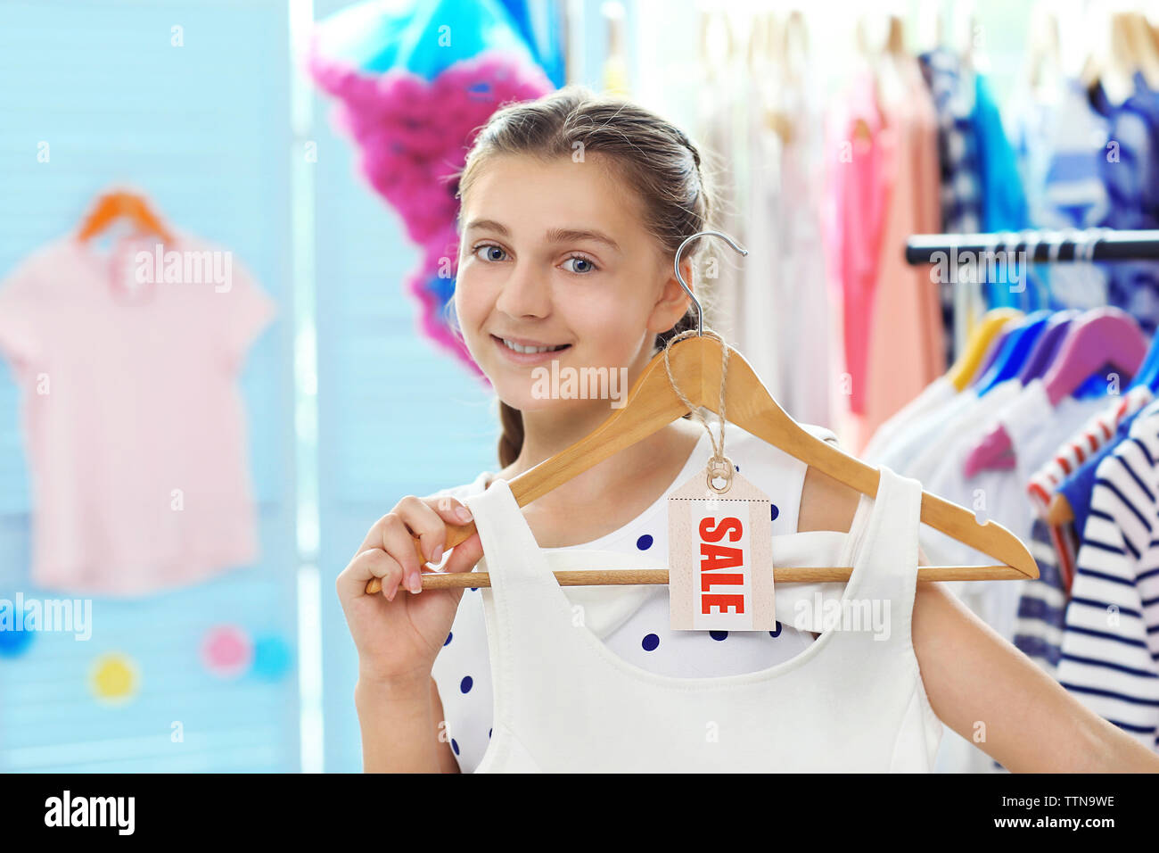 Pretty girl choosing clothes Stock Photo - Alamy
