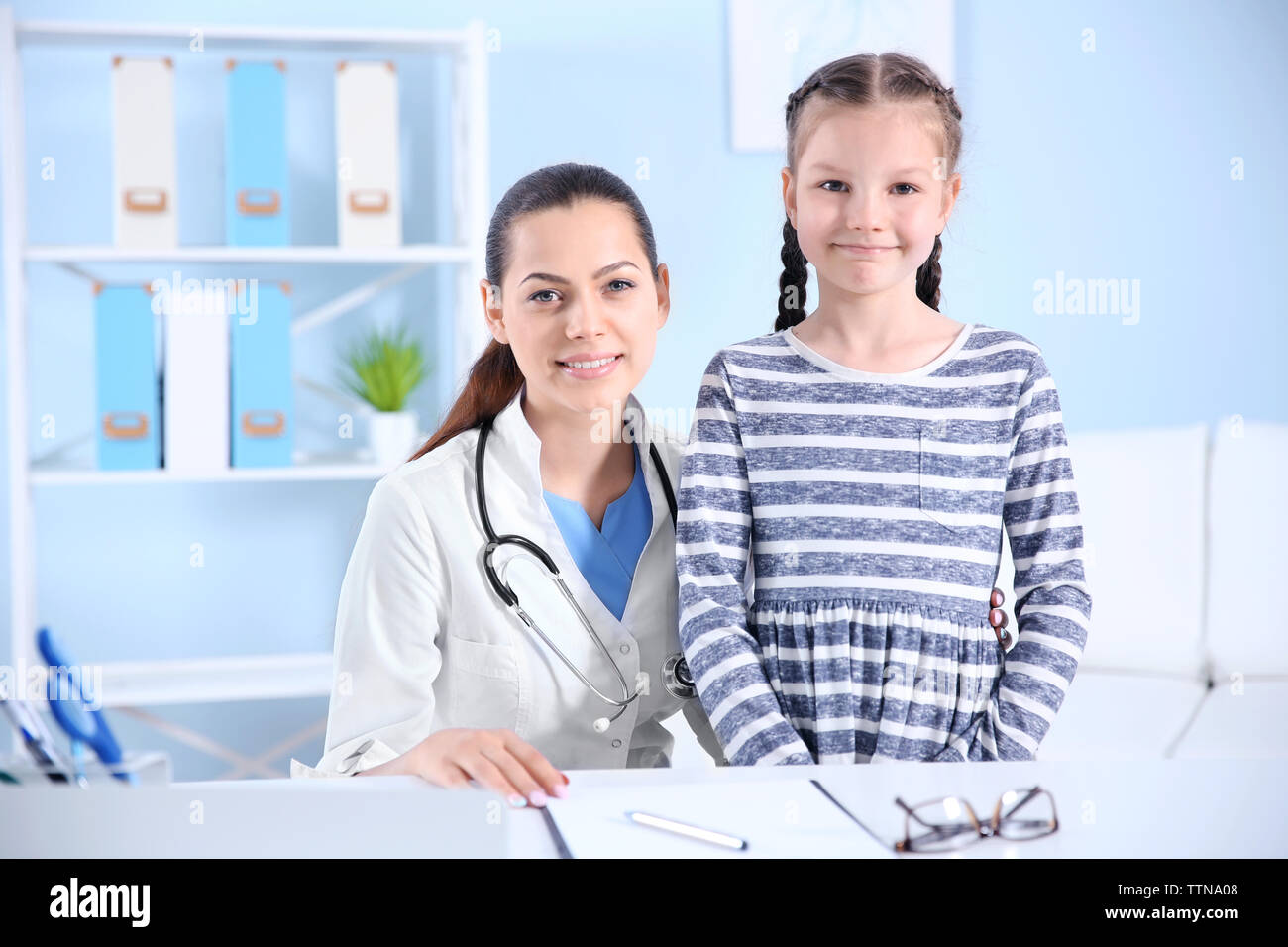 Cute girl visiting a doctor Stock Photo - Alamy