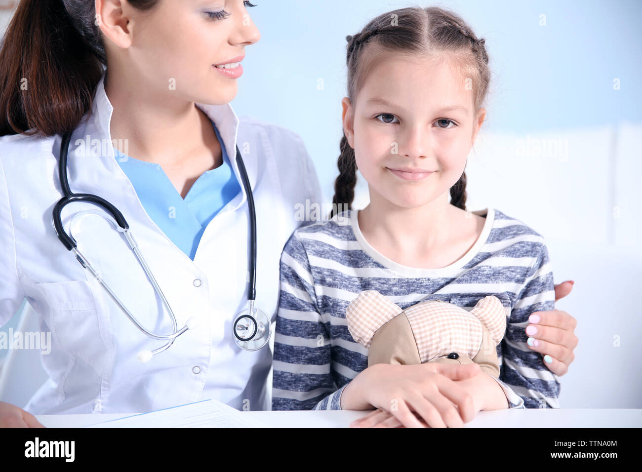 Cute girl visiting a doctor Stock Photo - Alamy