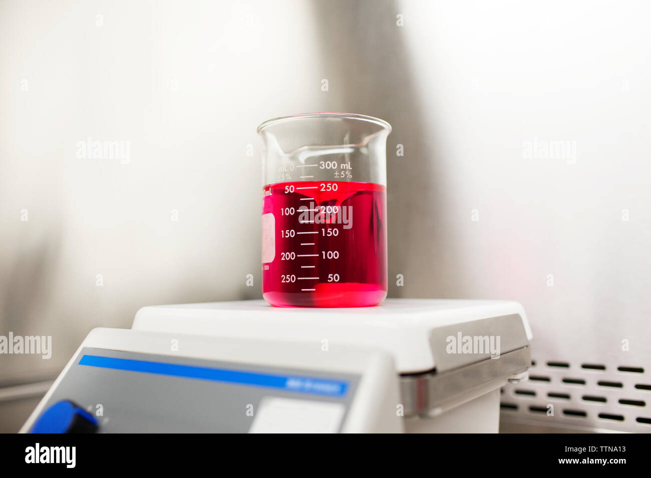 Test tube on weight scale Stock Photo - Alamy