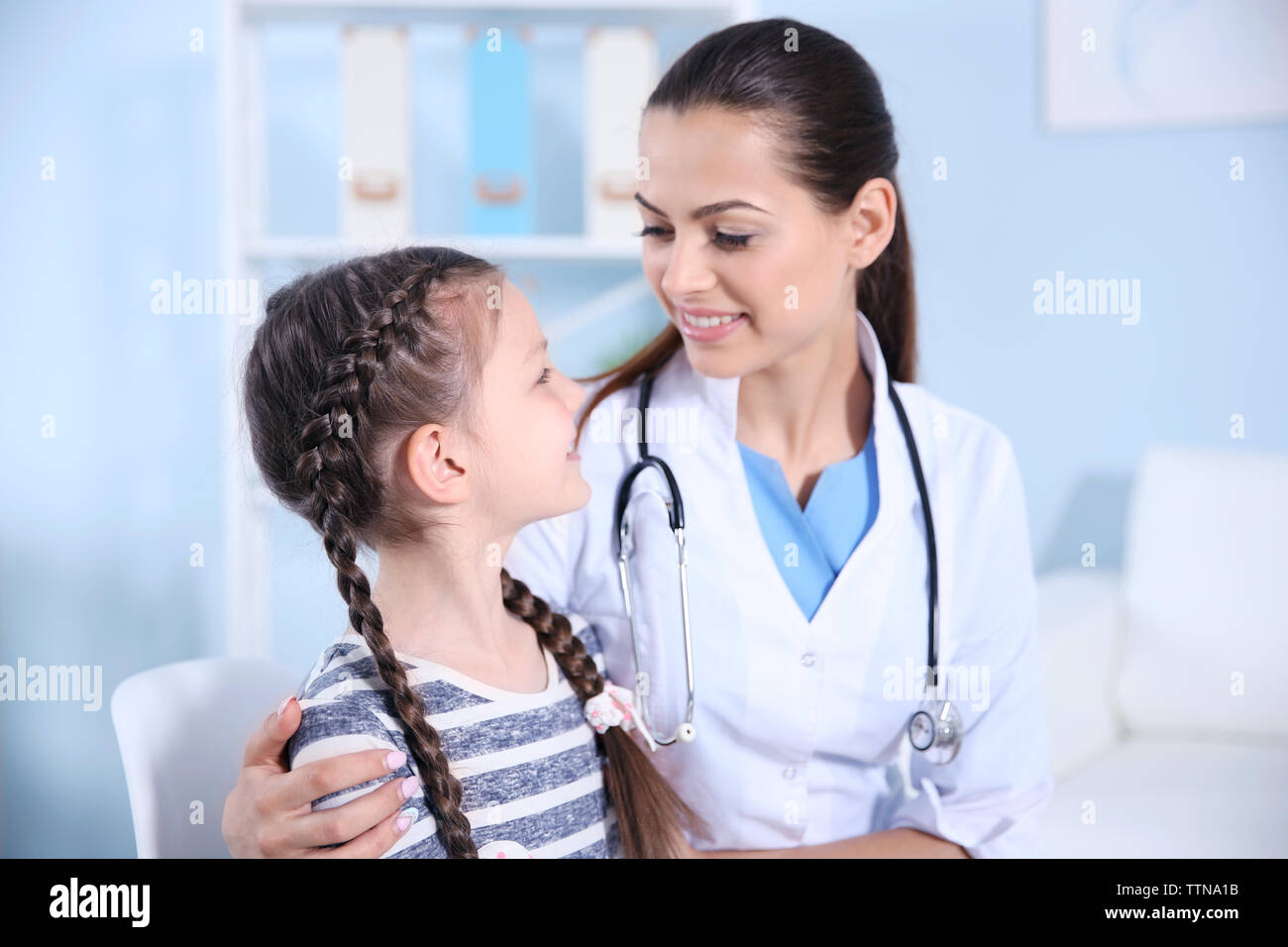 Cute girl visiting a doctor Stock Photo - Alamy
