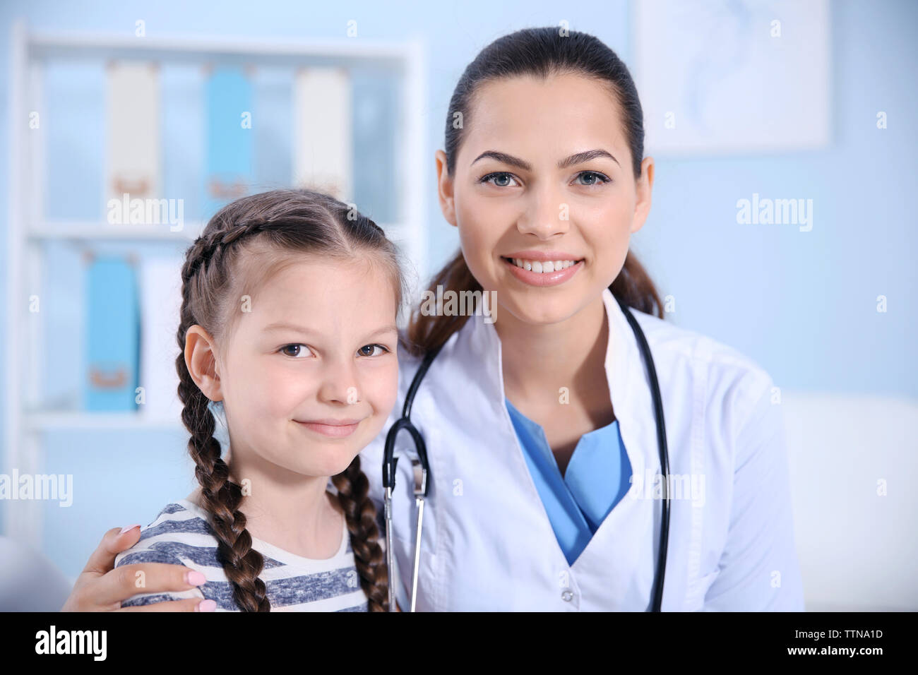 Cute girl visiting a doctor Stock Photo - Alamy