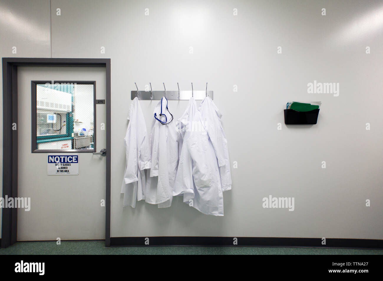 Coats hanging wall hi-res stock photography and images - Alamy