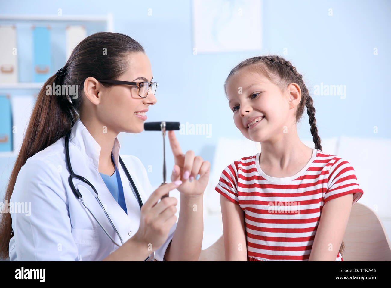 Cute girl visiting doctor Stock Photo - Alamy