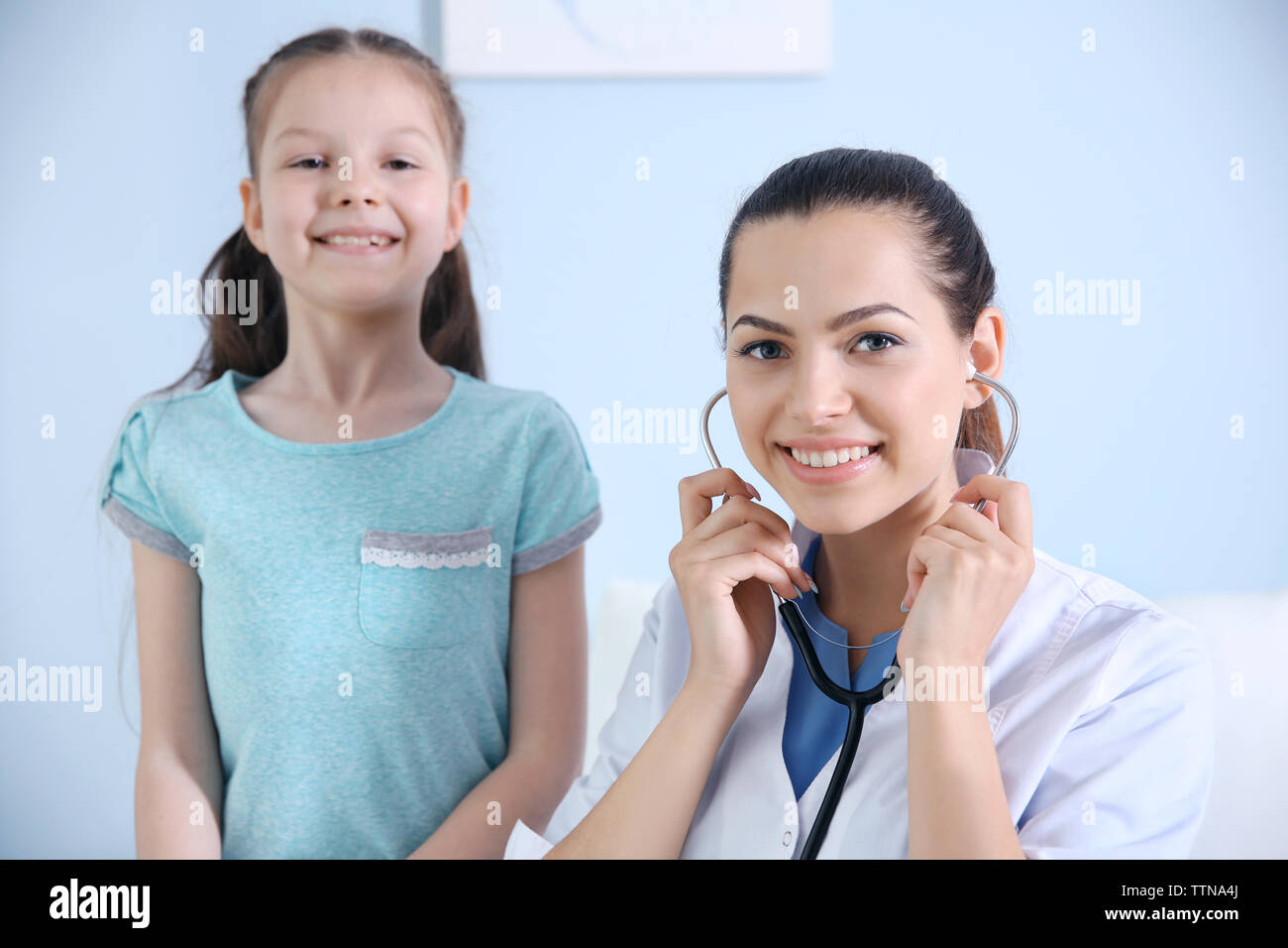 Cute girl visiting a doctor Stock Photo - Alamy